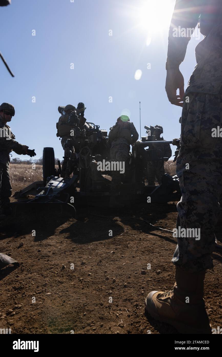 U.S. Marine Corps Lance Cpl. Rolando Romero loads high explosive rounds ...