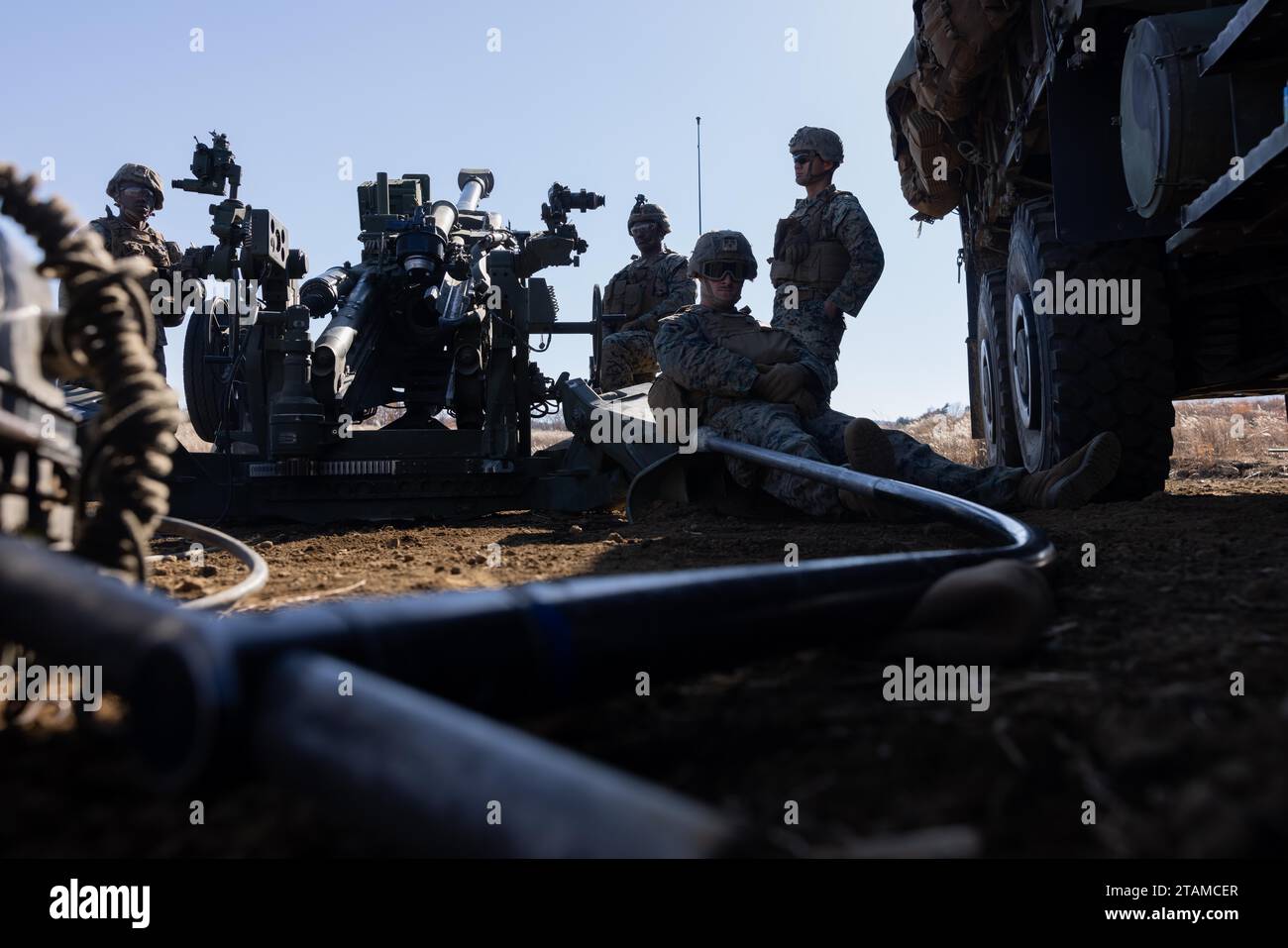 U.S. Marines prepare to execute a fire mission using an M777 Howitzer ...