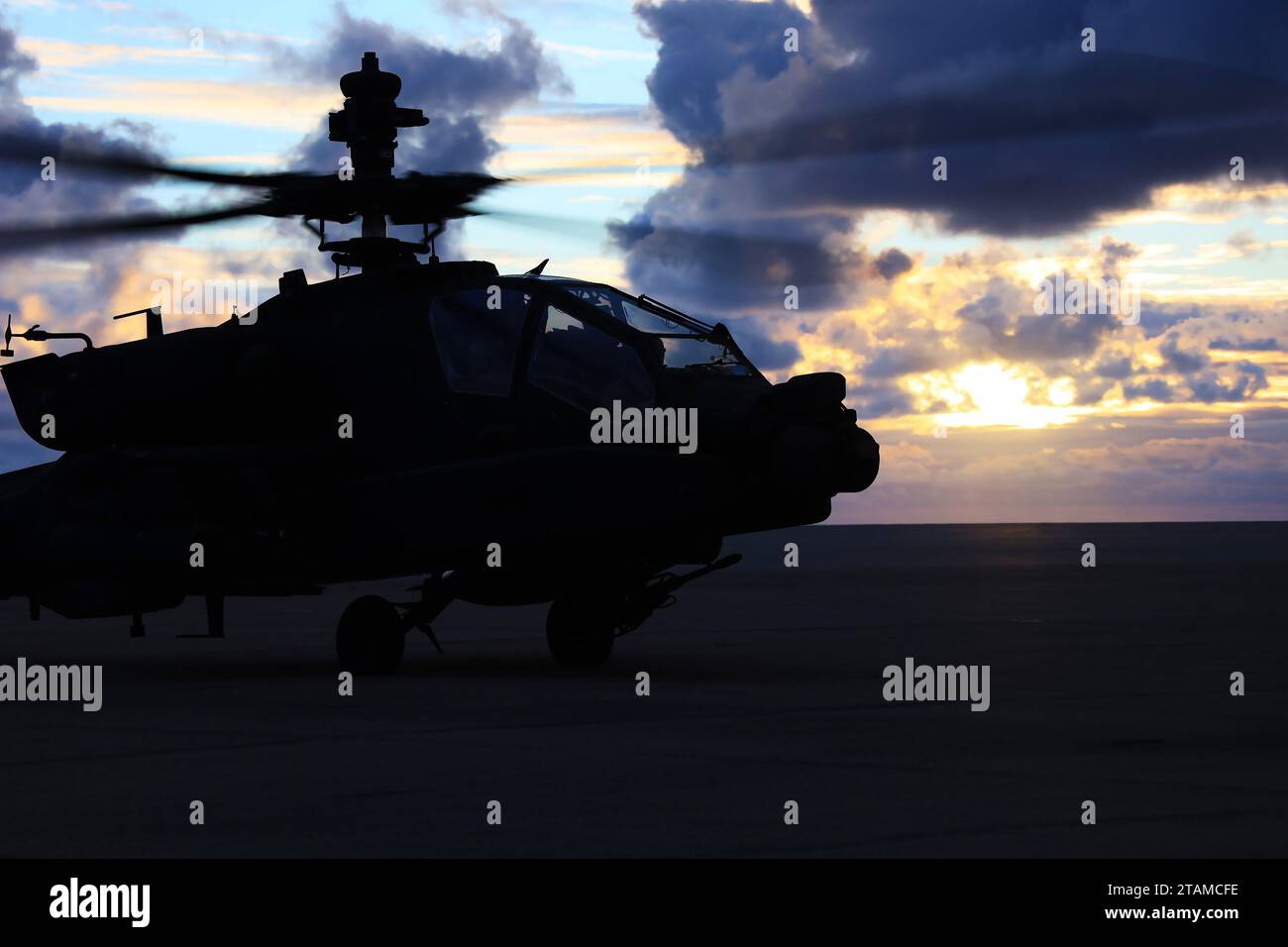An AH-64 Apache comes in for a landing as part of a Flight Deck Landing ...