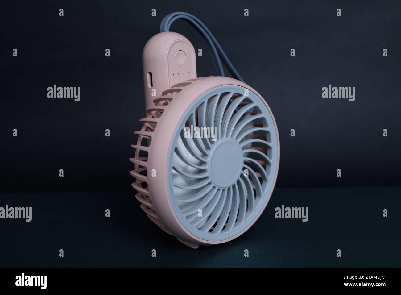 Mini electric pink pan, isolated on dark background. front side view ...