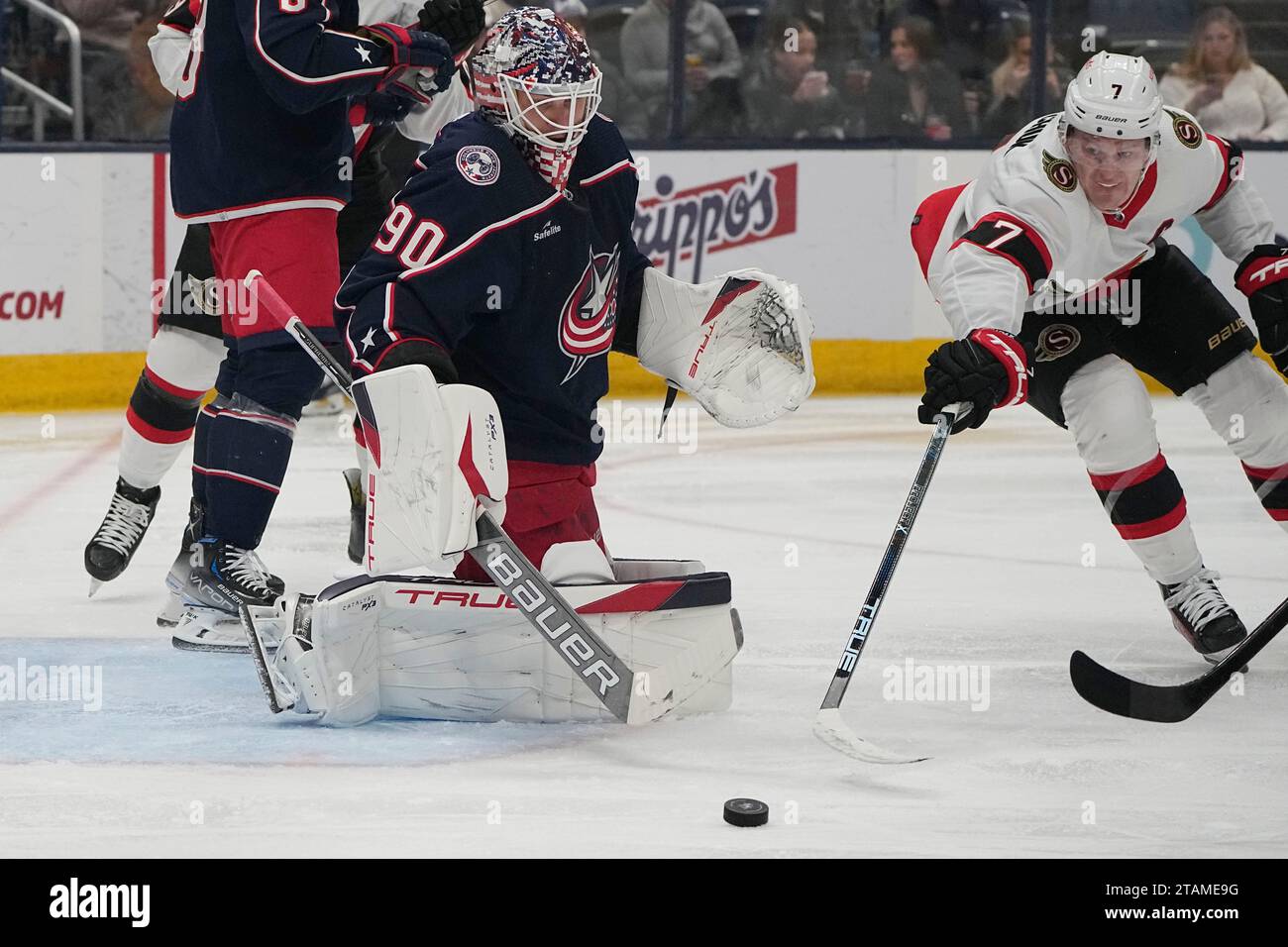 Ottawa Senators left wing Brady Tkachuk (7) reaches for the puck in ...