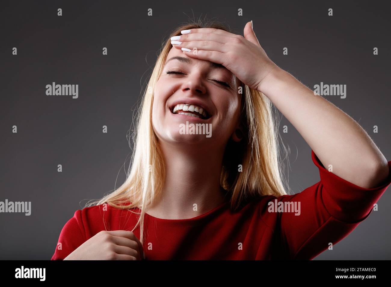 She chuckles wholeheartedly, her blonde hair tousled by her own ...