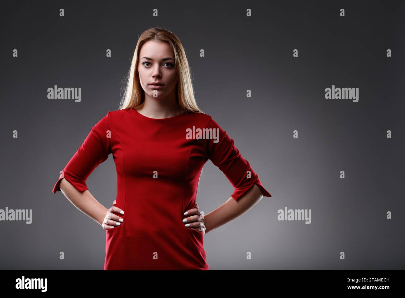 Authority emanates from the woman, her stance firm and expression ...