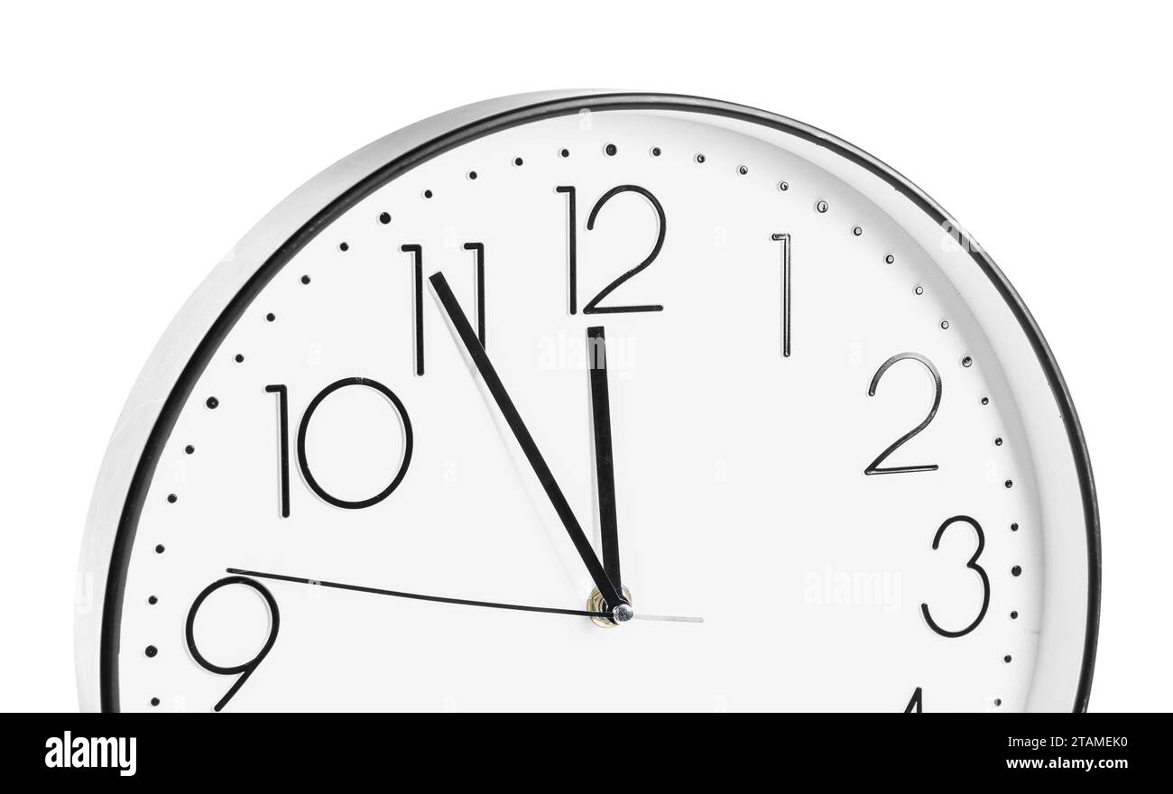 Clock showing five minutes until midnight on white background, closeup ...