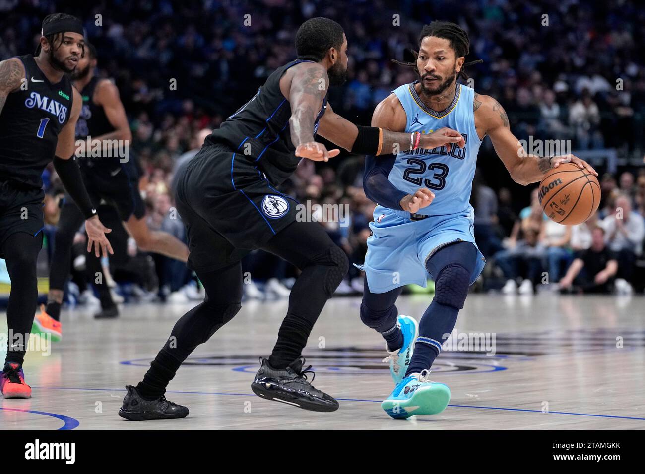 Memphis Grizzlies guard Derrick Rose (23) works to the basket as Dallas Mavericks guard Kyrie ...