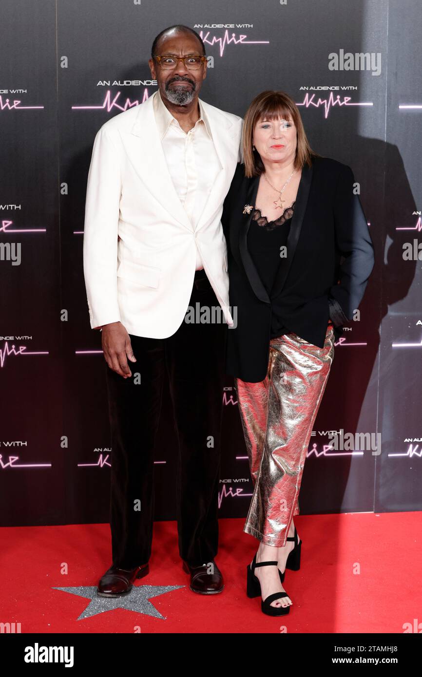 Lenny Henry, left, and Lisa Makin pose for photographers upon arrival ...