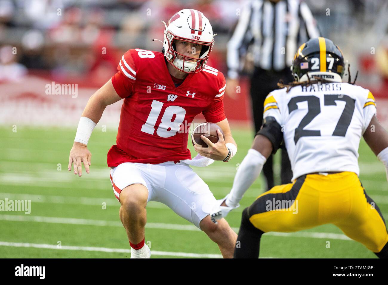 Wisconsin Badgers quarterback Braedyn Locke (18) carries the ball ...