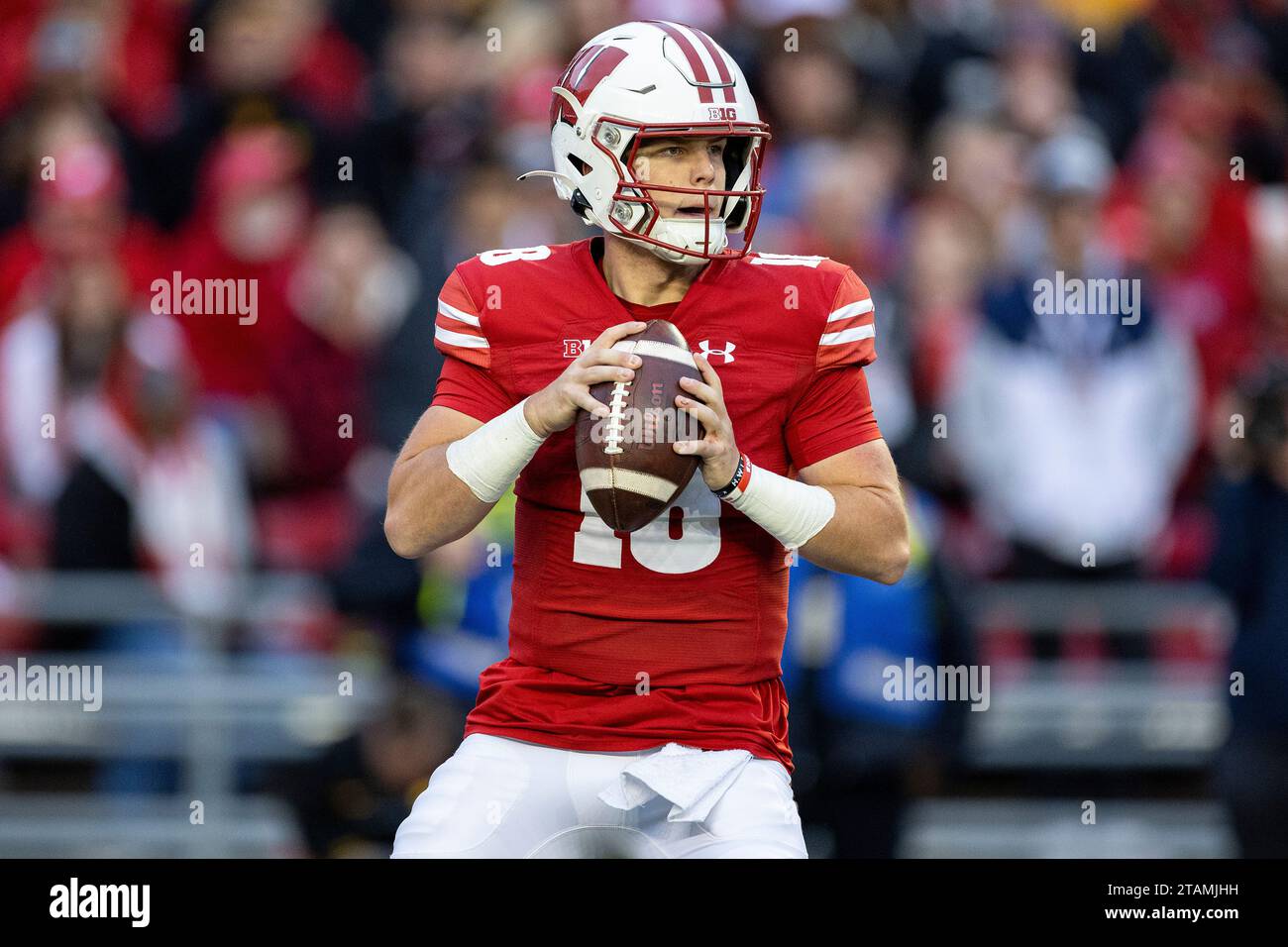 Wisconsin Badgers quarterback Braedyn Locke (18) looks for a receiver ...