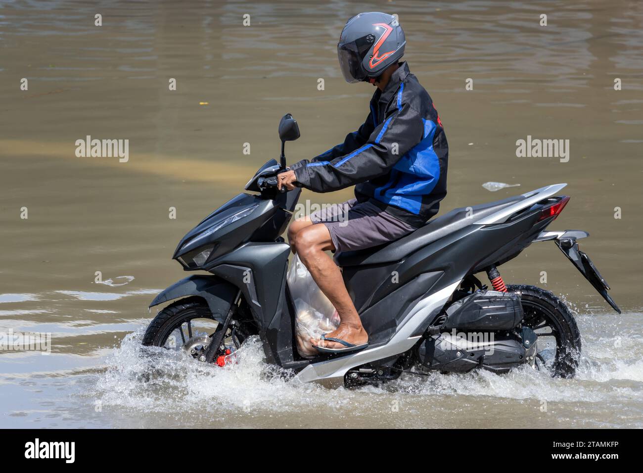 Motorbike on flooded road hi-res stock photography and images - Alamy