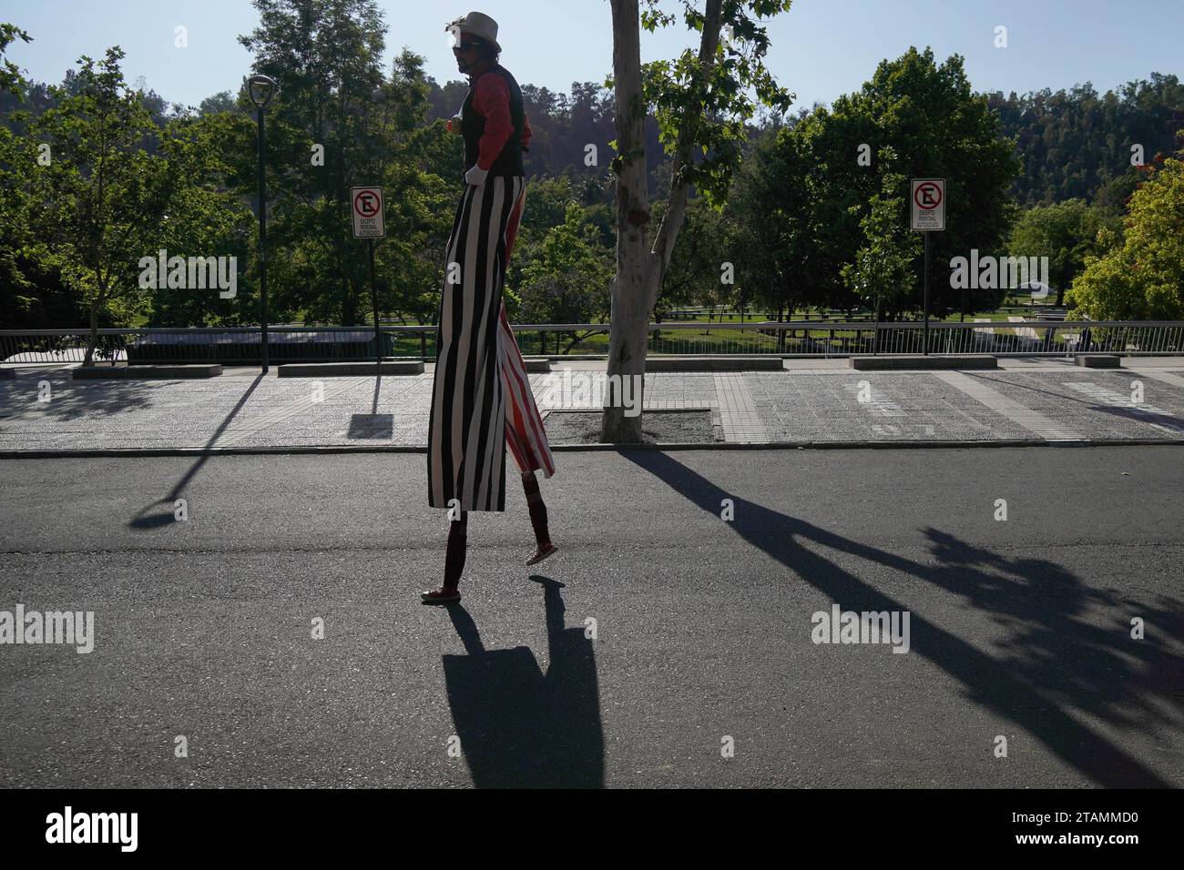 Santiago, Metropolitana, Chile. 1st Dec, 2023. A circus performer walks ... Santiago, Metropolitana, Chile. 1st Dec, 2023. A circus performer walks ...