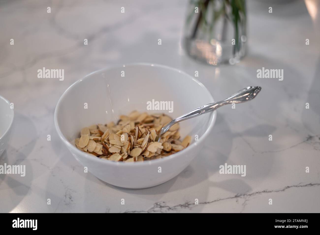 Bowl of Shredded Almonds Marble Kitchen Counter Stock Photo - Alamy
