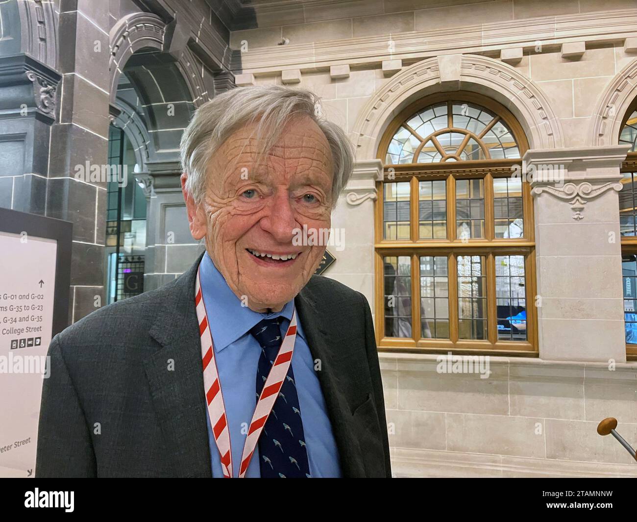 London, UK. 01st Dec, 2023. Lord Alfred Dubs smiles in the foyer of the ...