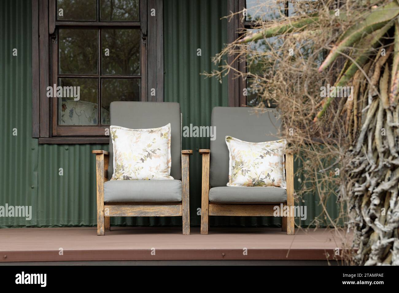 Two chairs on porch of country cottage, vacation travel, South Africa ...