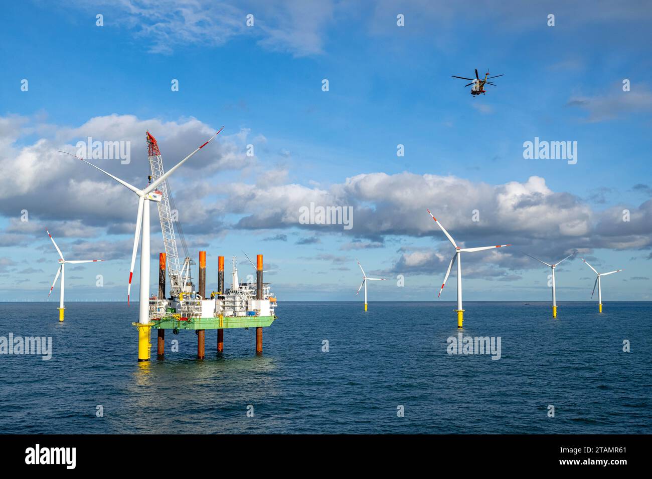 Germany. 16th Nov, 2023. A helicopter flies over the Riffgat offshore ...
