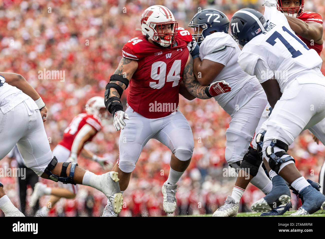 Wisconsin Badgers defensive lineman Gio Paez (94) defends during an ...