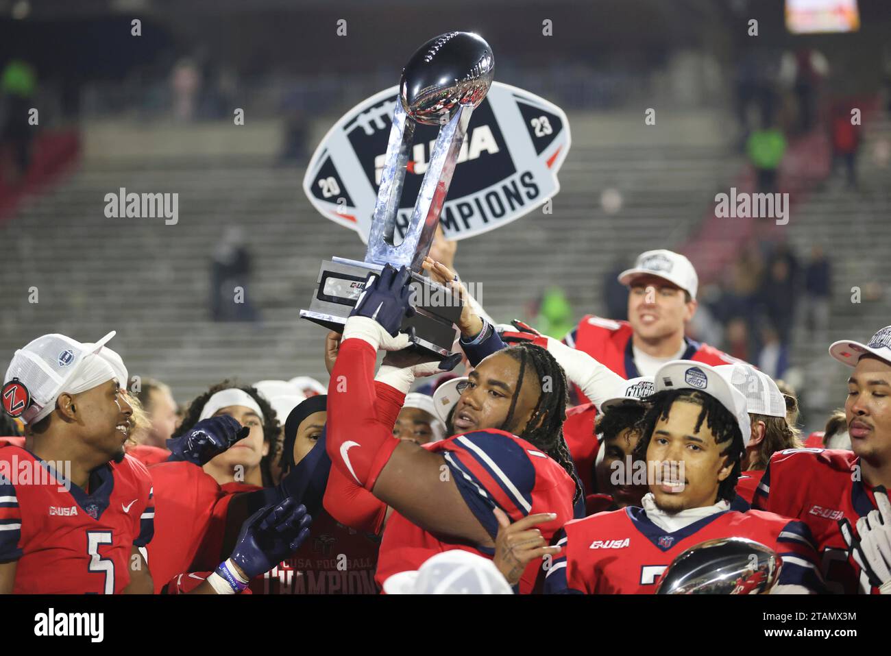 December 1, 2023: Liberty Flames hoist the championship trophy the NCAA ...