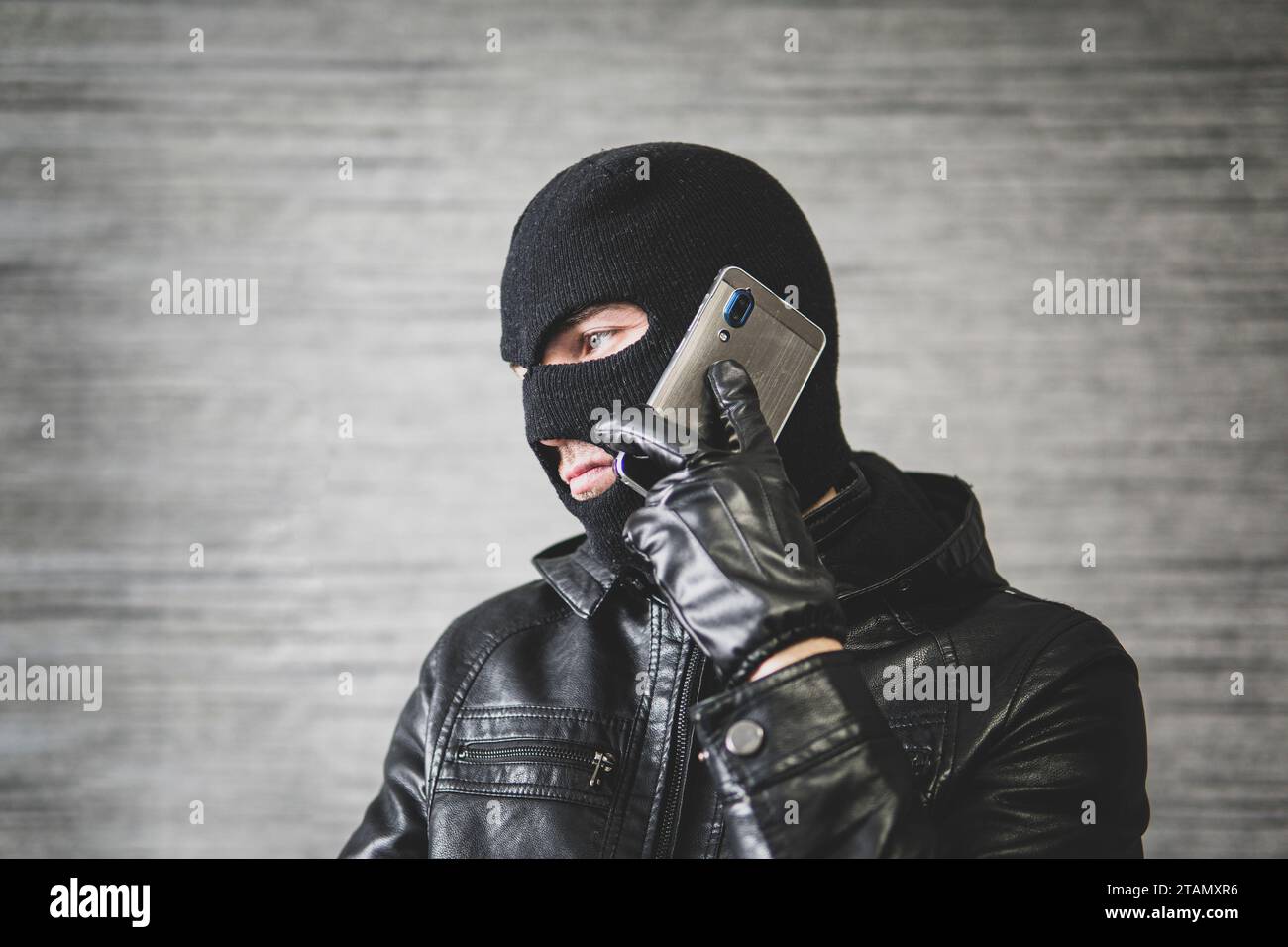 Person makes mobile phone call danger hi-res stock photography and ...