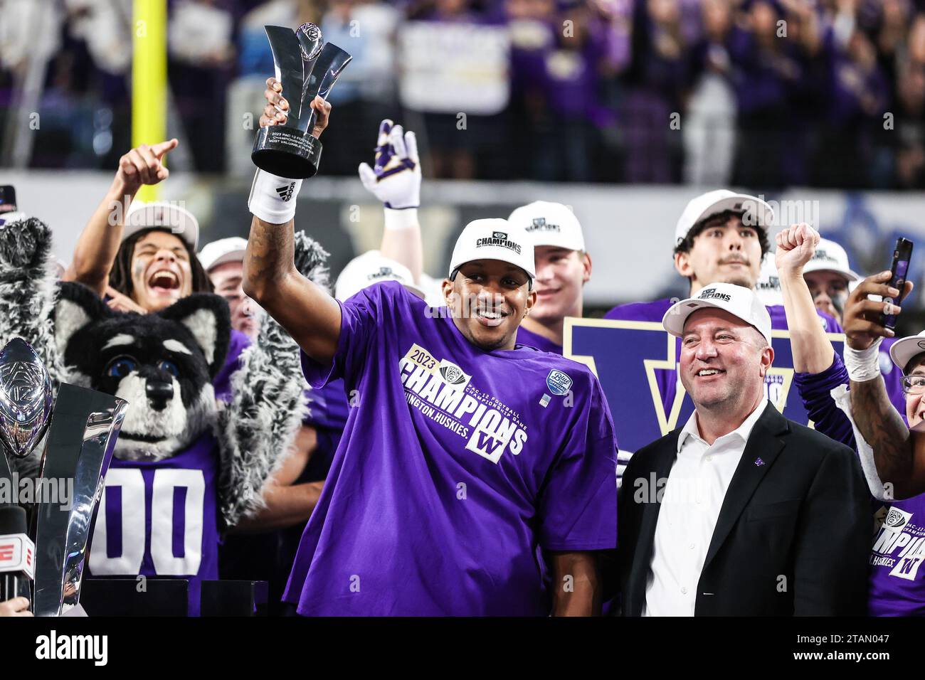 December 01, 2023: Washington Huskies quarterback Michael Penix Jr. (9) lifts up the MVP trophy ...