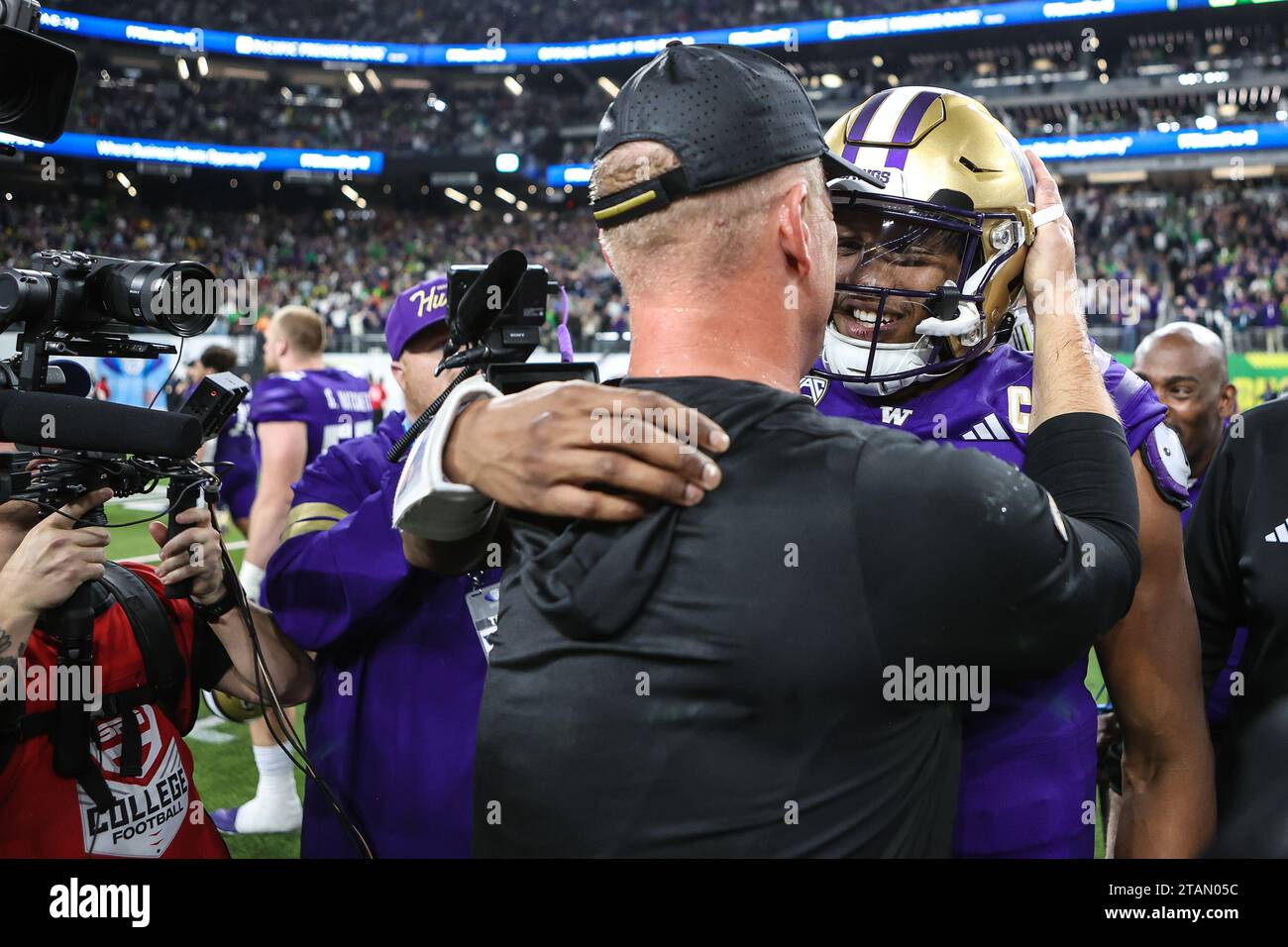December 01, 2023: Washington Huskies head coach Kalen DeBoer hugs Washington Huskies ...