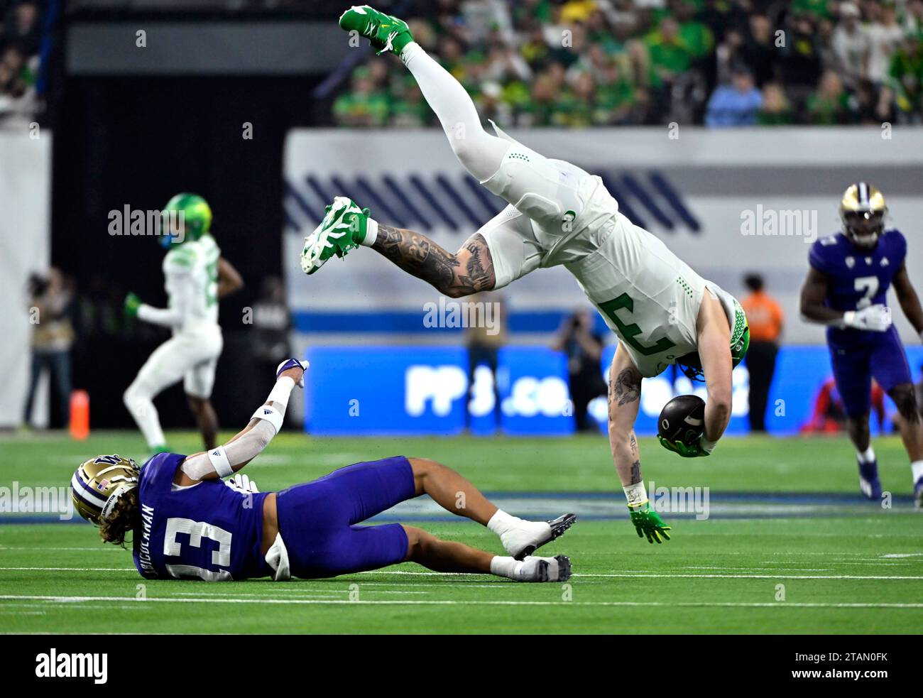 Oregon tight end Terrance Ferguson (3) is tripped by Washington ...