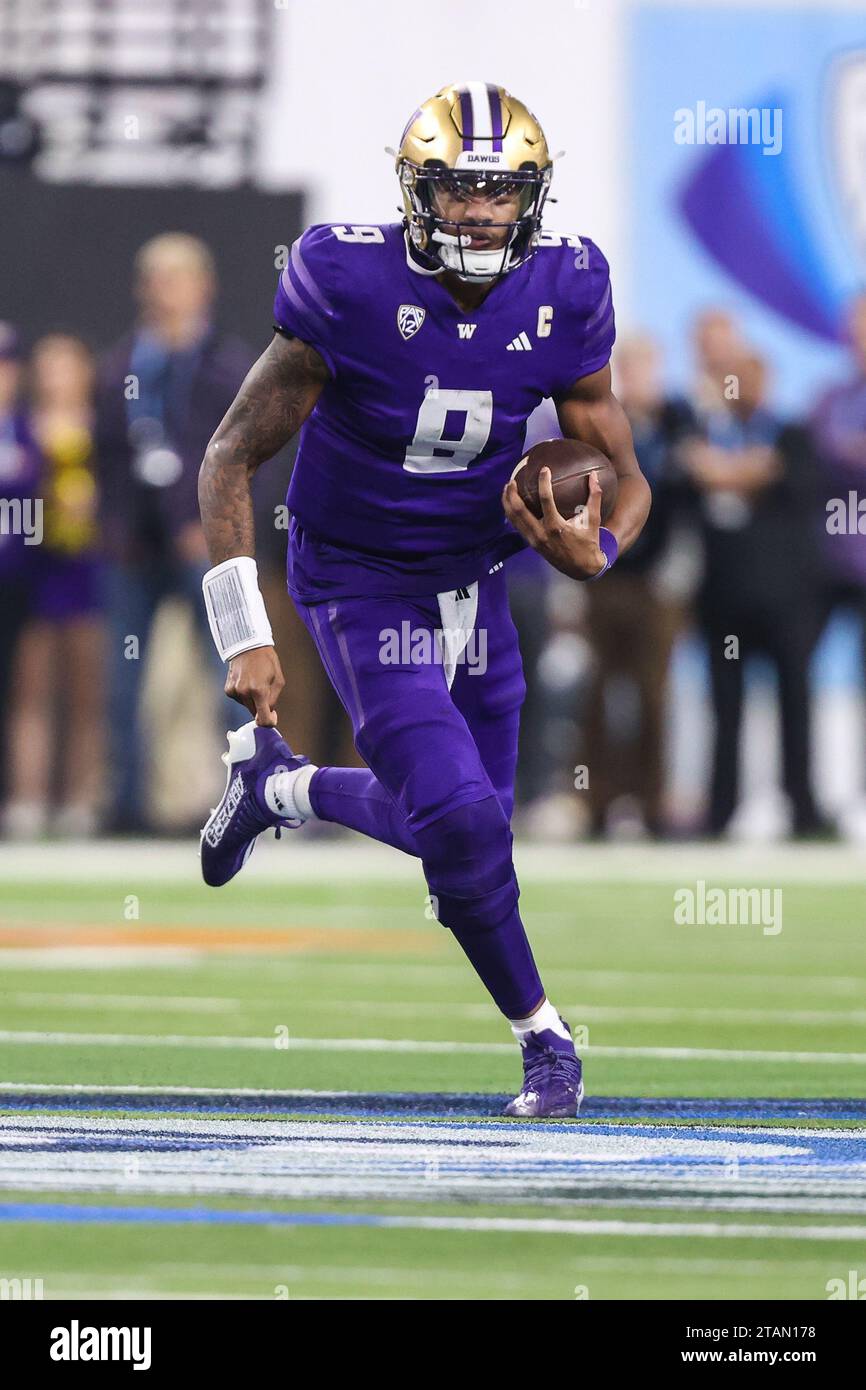 December 01, 2023: Washington Huskies quarterback Michael Penix Jr. (9) runs with the football ...