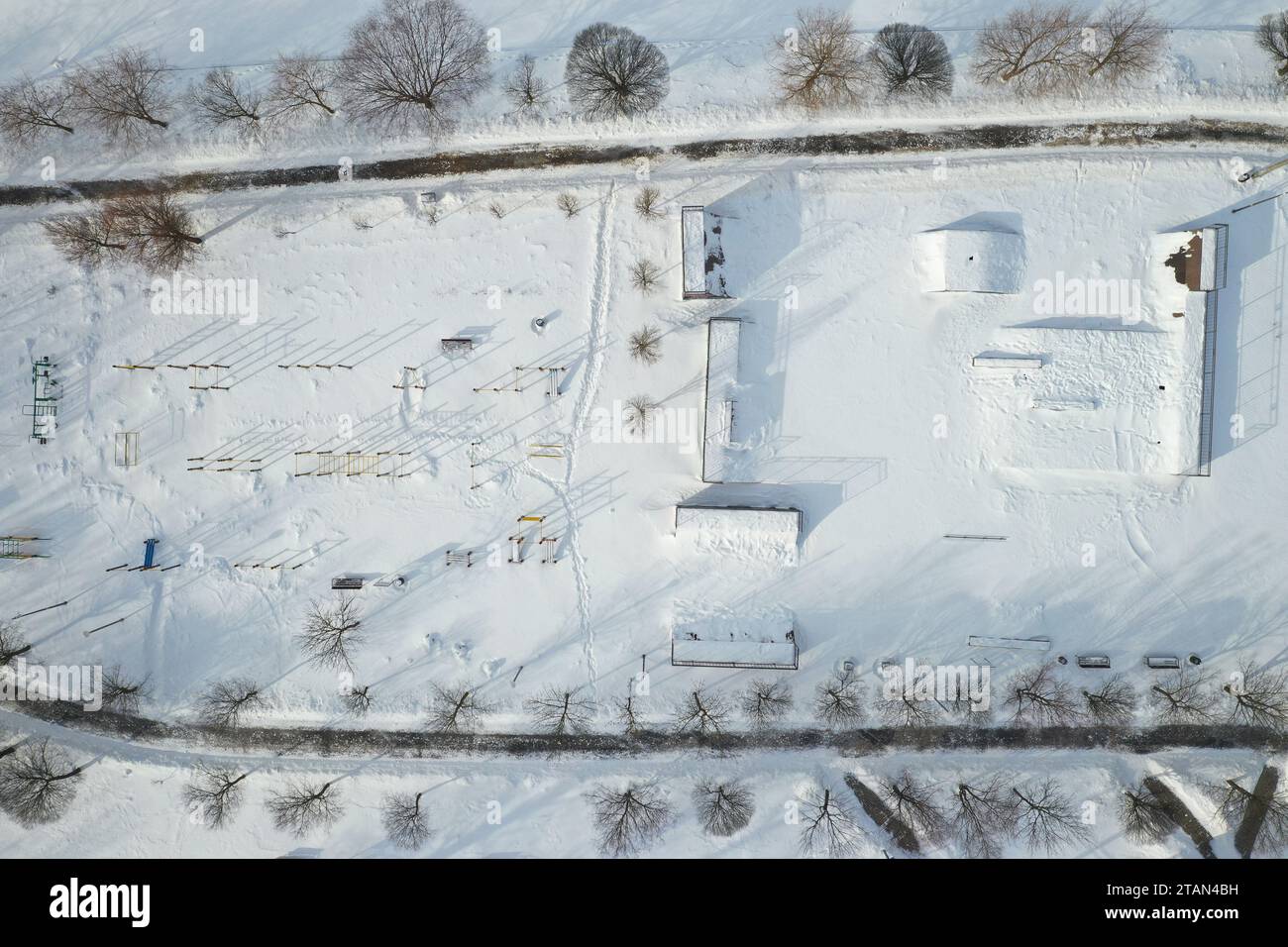 Top view of an empty sports field in a winter park. Infrastructure for ...