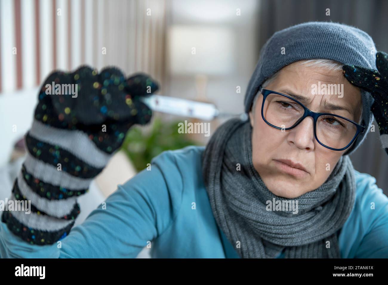 Woman measuring body temperature Stock Photo - Alamy