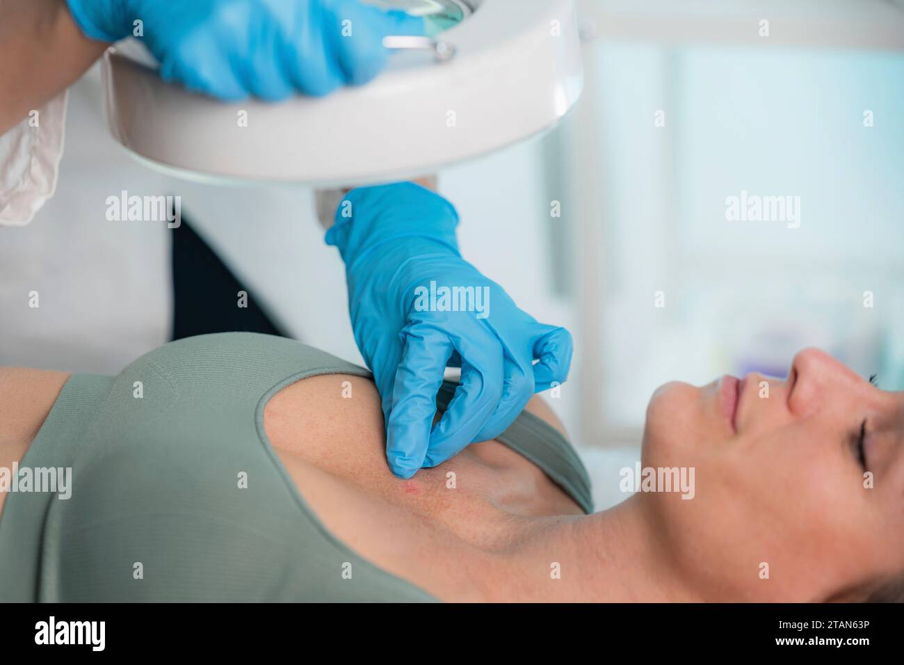 Dermatologist examining moles patient hi-res stock photography and ...