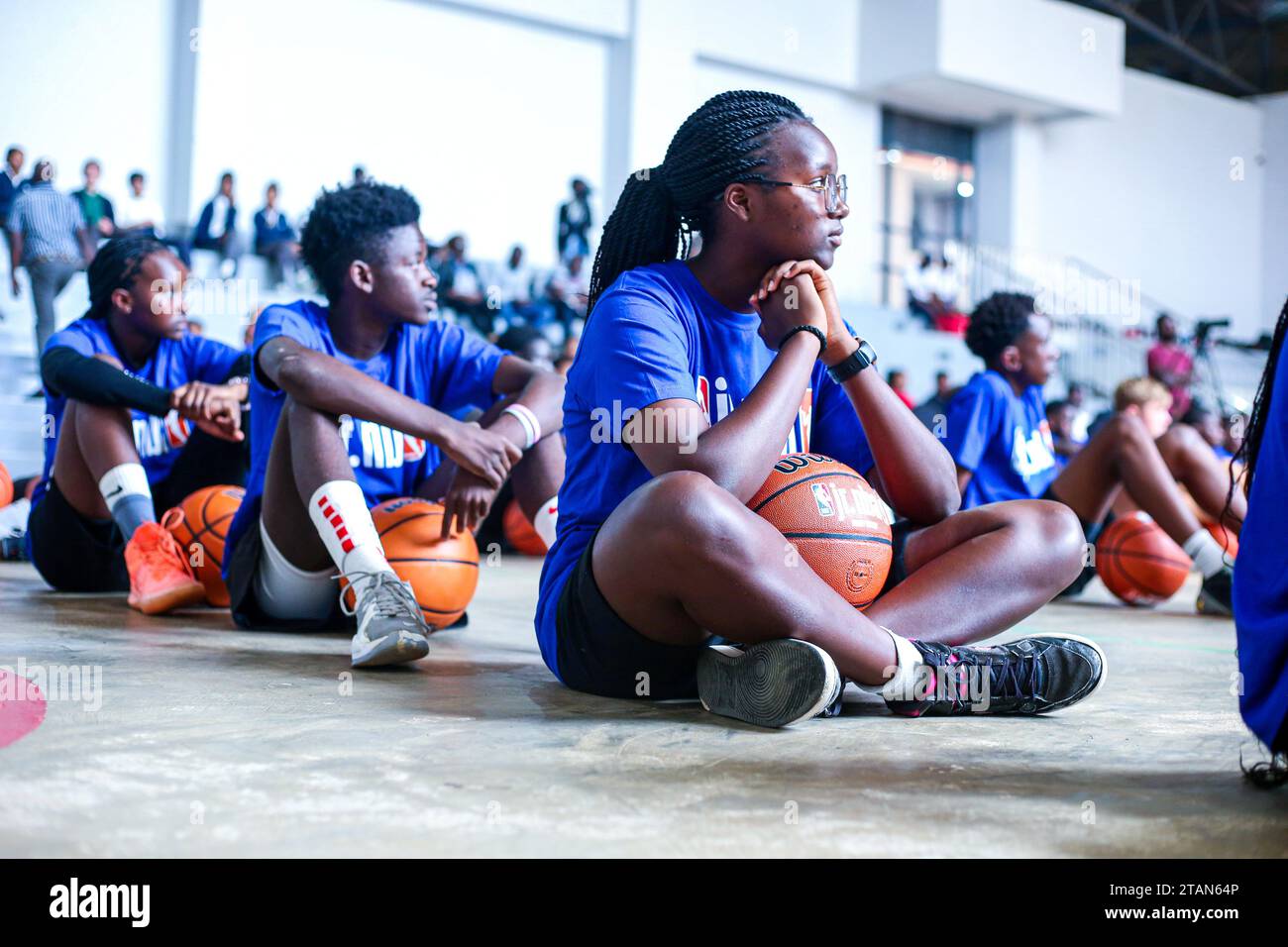 NAIROBI, KENYA - NOVEMBER 29: Basketball players listen to Five time ...