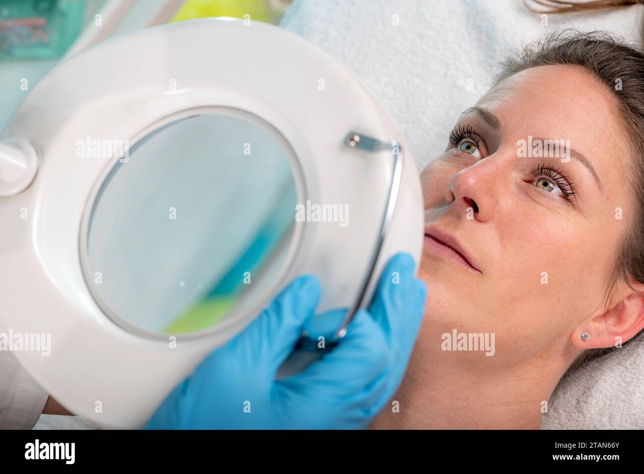 Dermatologist checking skin Stock Photo - Alamy
