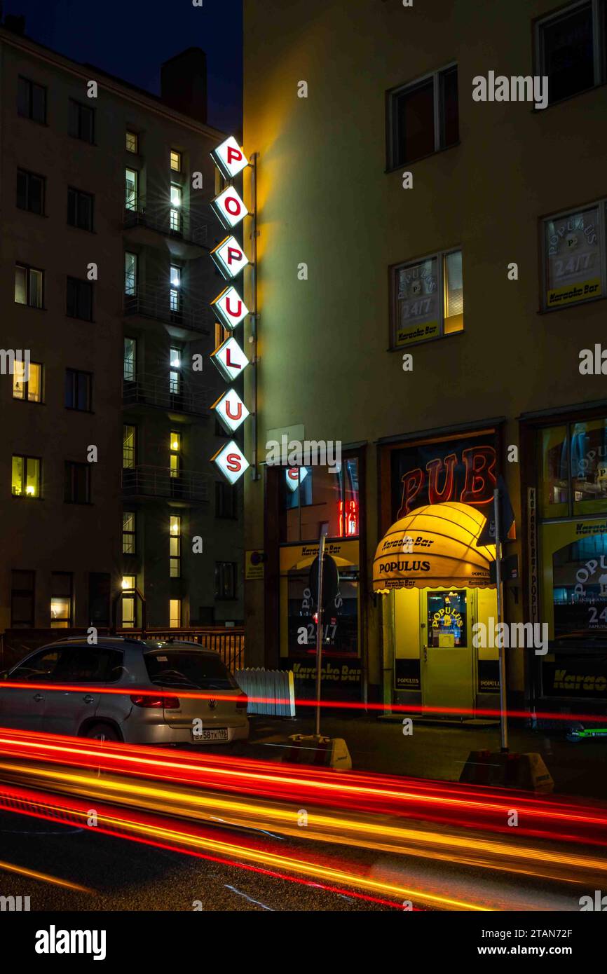 Karaoke bar Populus after dark with long-exposure taillight trails ...
