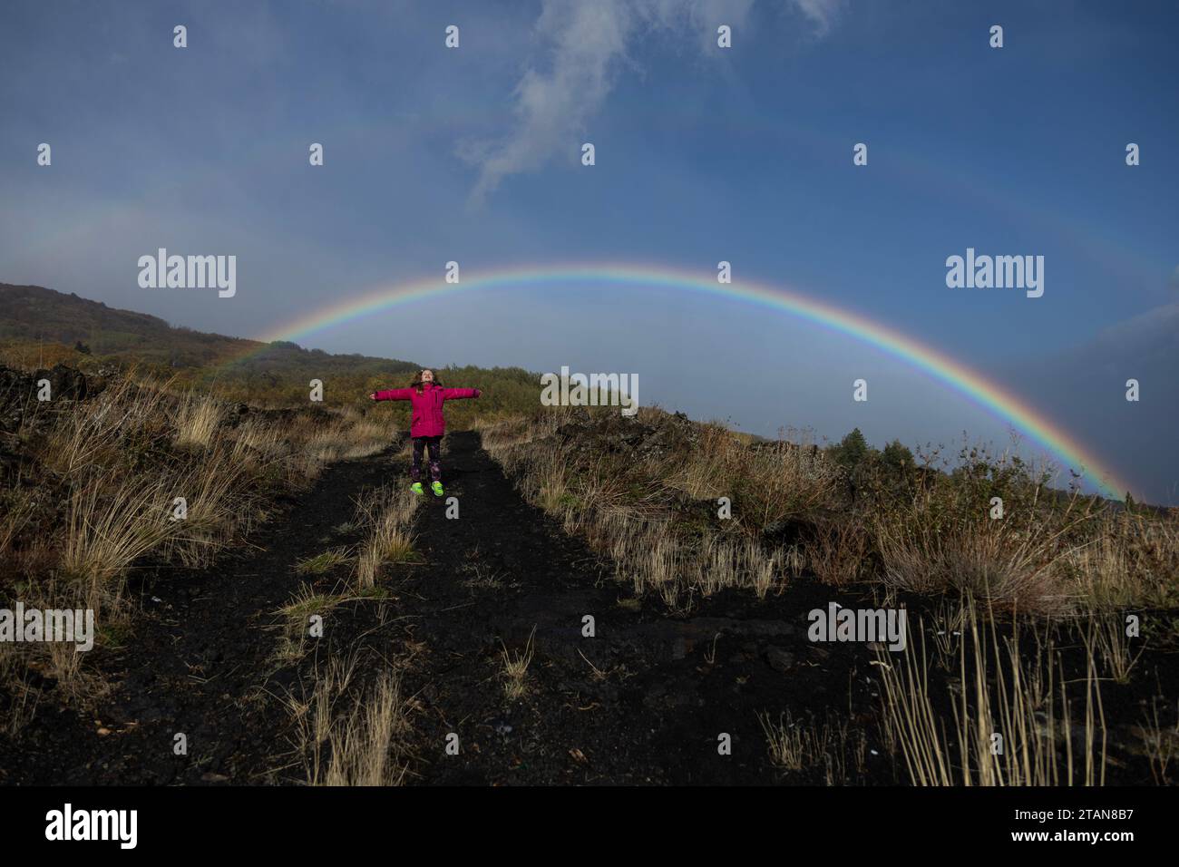 Rainbow over the mount Etna active volcano in Sicily, Italia. Black ...