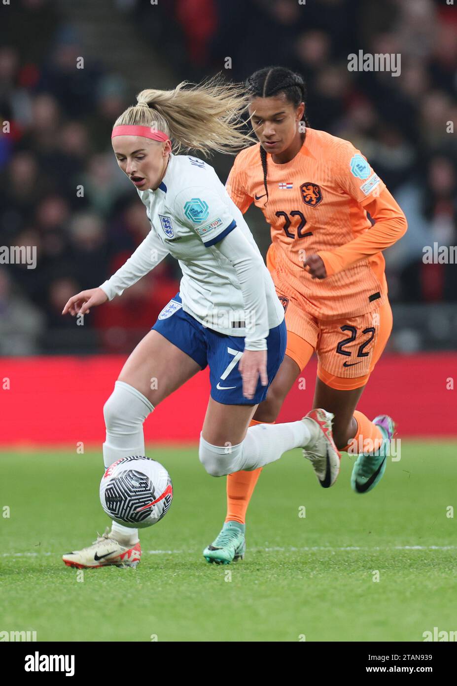 Chloe Kelly (Manchester City) of England Women holds of Esmee Brugts of ...