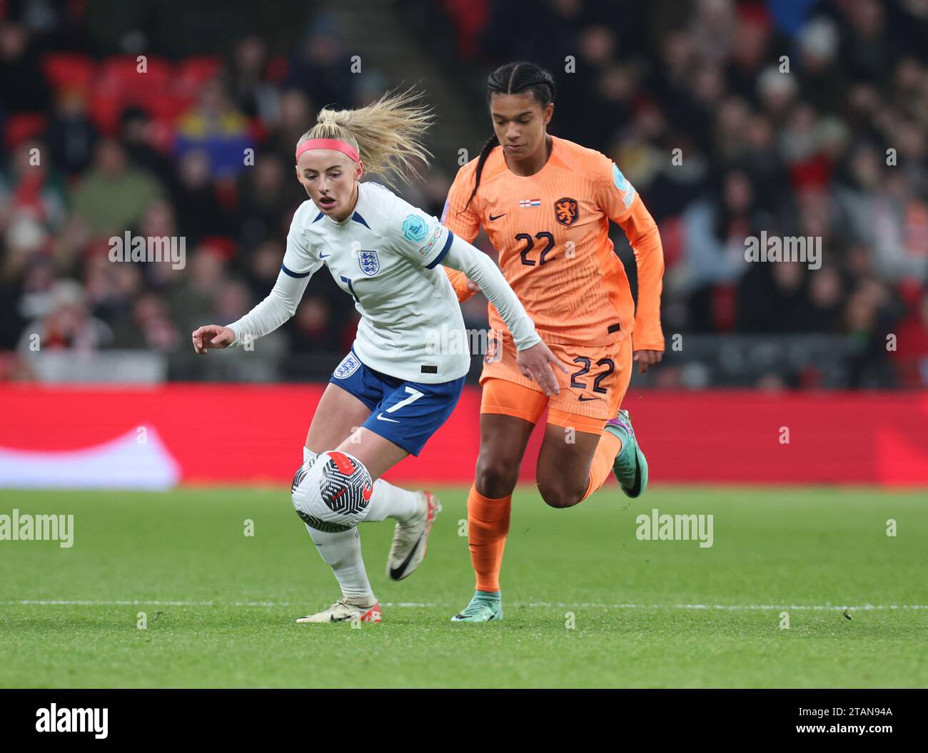 Chloe Kelly (Manchester City) of England Women holds of Esmee Brugts of ...