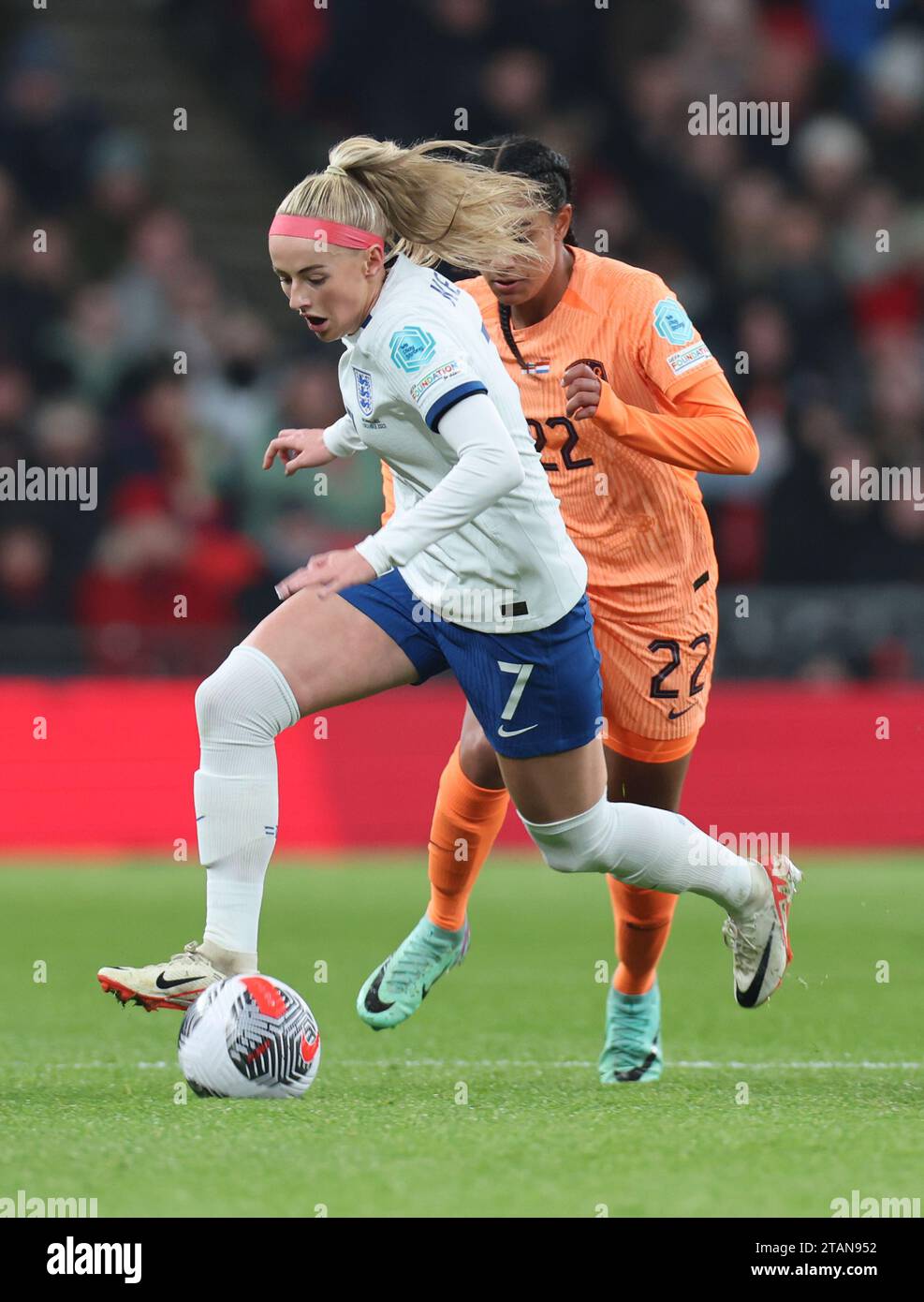 Chloe Kelly (Manchester City) of England Women holds of Esmee Brugts of ...