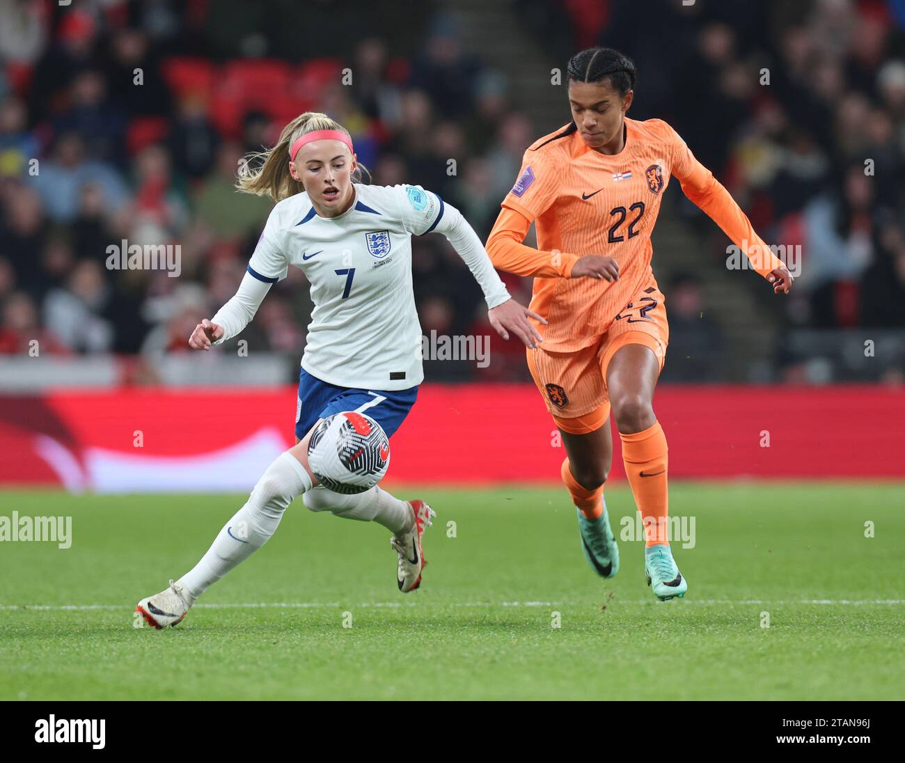 Chloe Kelly (Manchester City) of England Women holds of Esmee Brugts of ...