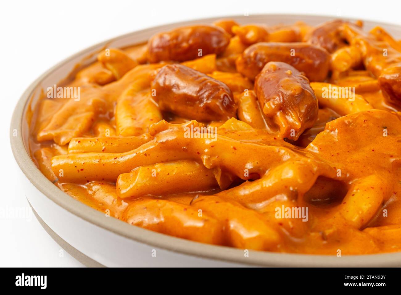 Rose noodle tteokbokki on white background Stock Photo - Alamy