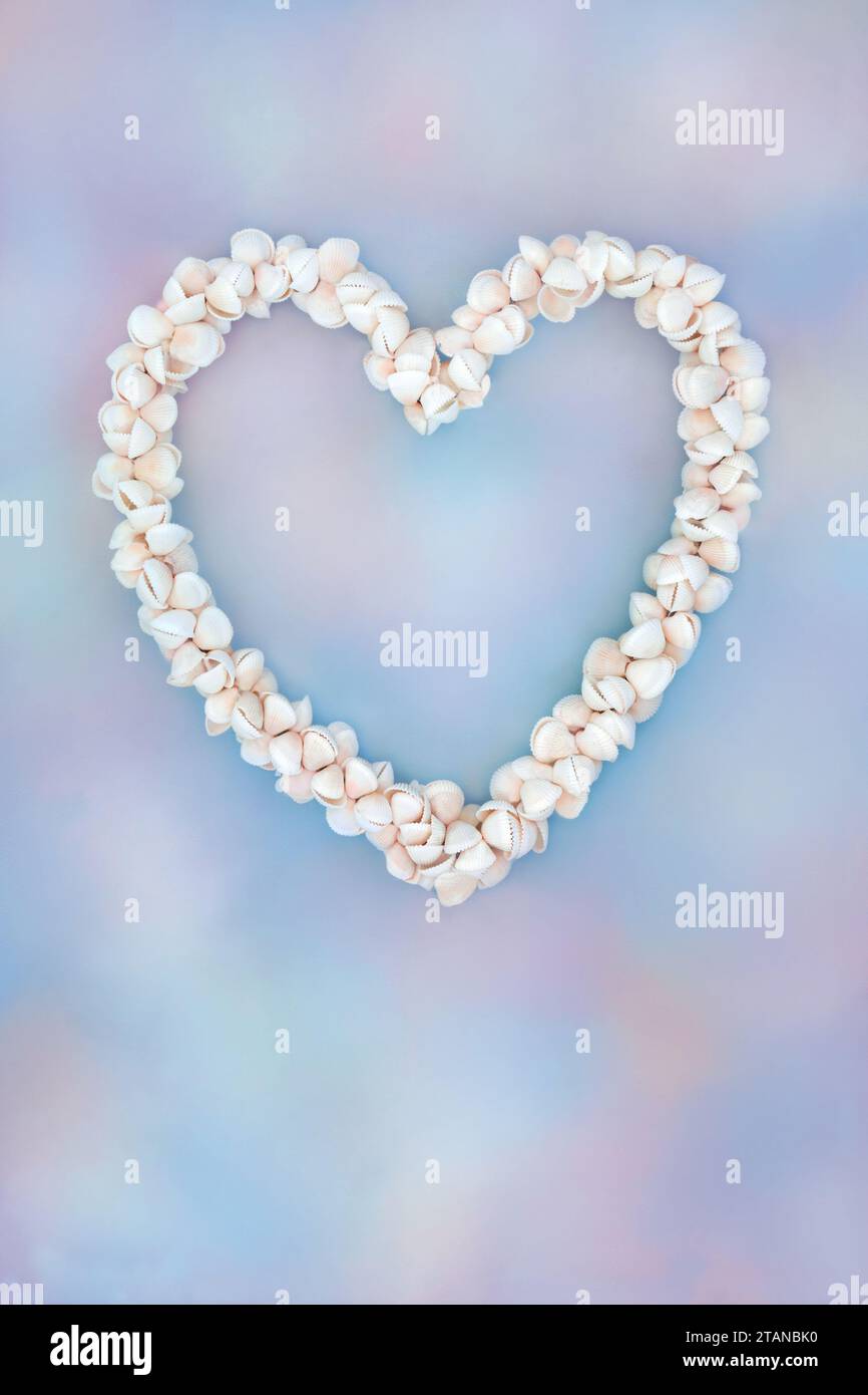 Heart shaped cockle shell wreath om rainbow sky cloud background ...
