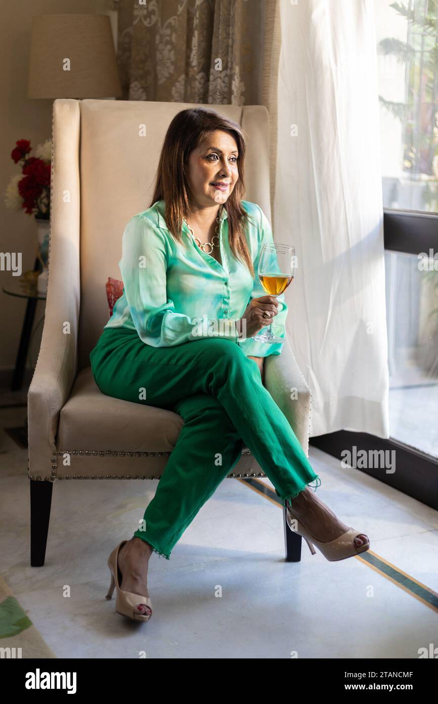 Young indian woman relaxing on chair hi-res stock photography and ...