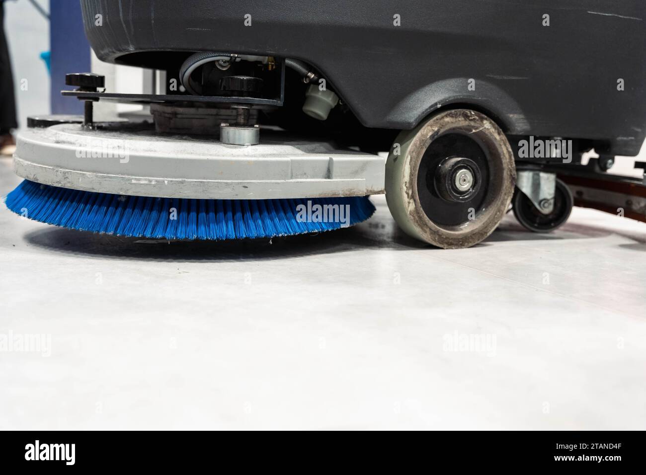 Close-up of a large round industrial vacuum cleaner brush designed for ...