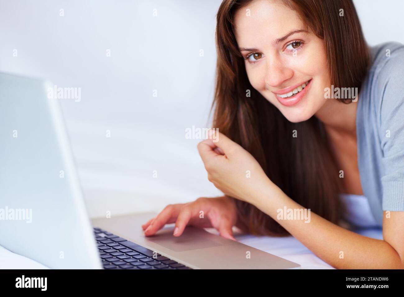 Home, portrait and woman with a laptop, smile and connection with ...