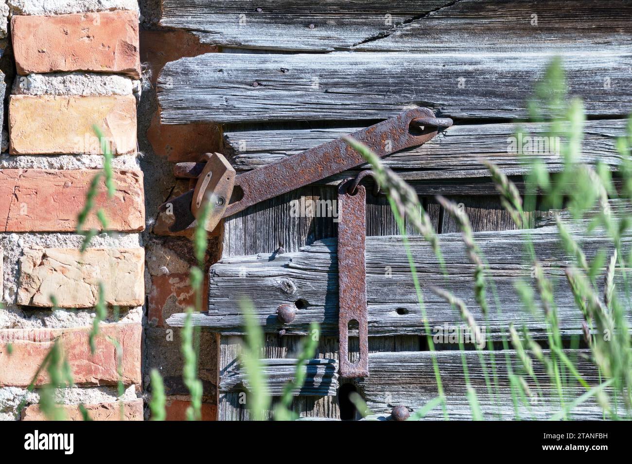old wooden plank door with metal lock and key on it Stock Photo - Alamy