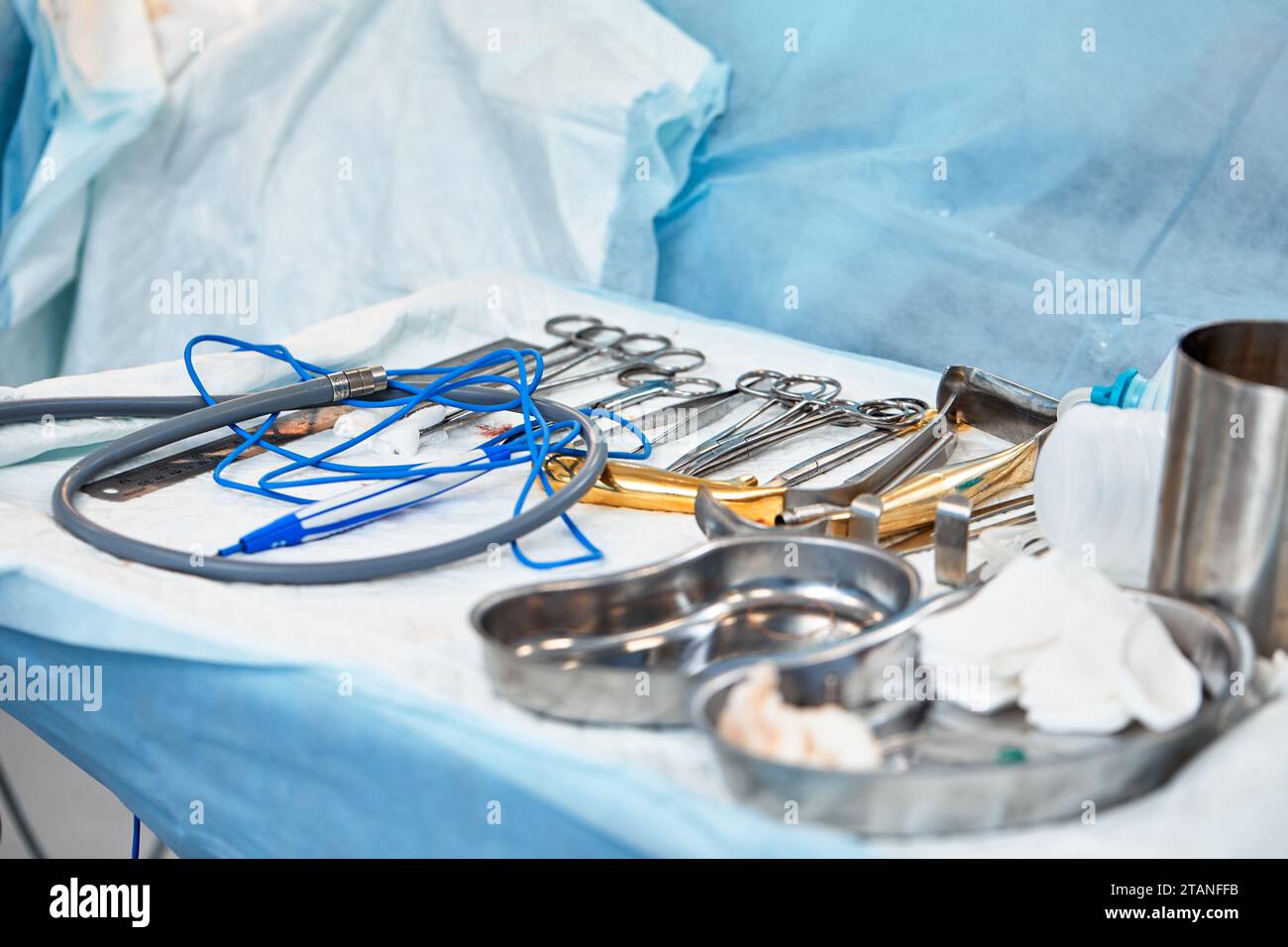 Set of surgical instrument laid out on a sterile blue cloth Stock Photo ...