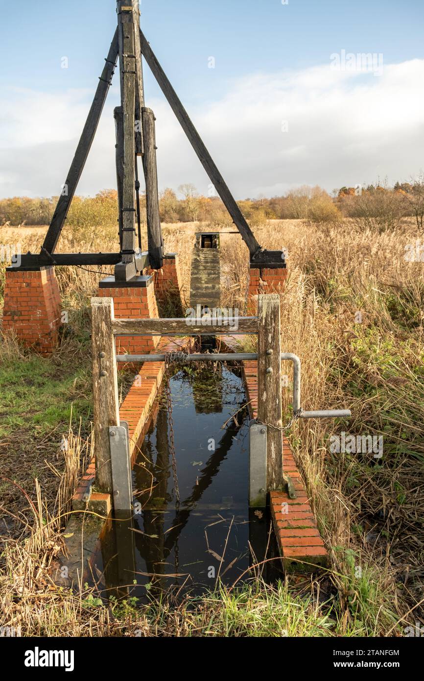 Old, disused and abandoned drainage pump on the riverbank Stock Photo ...