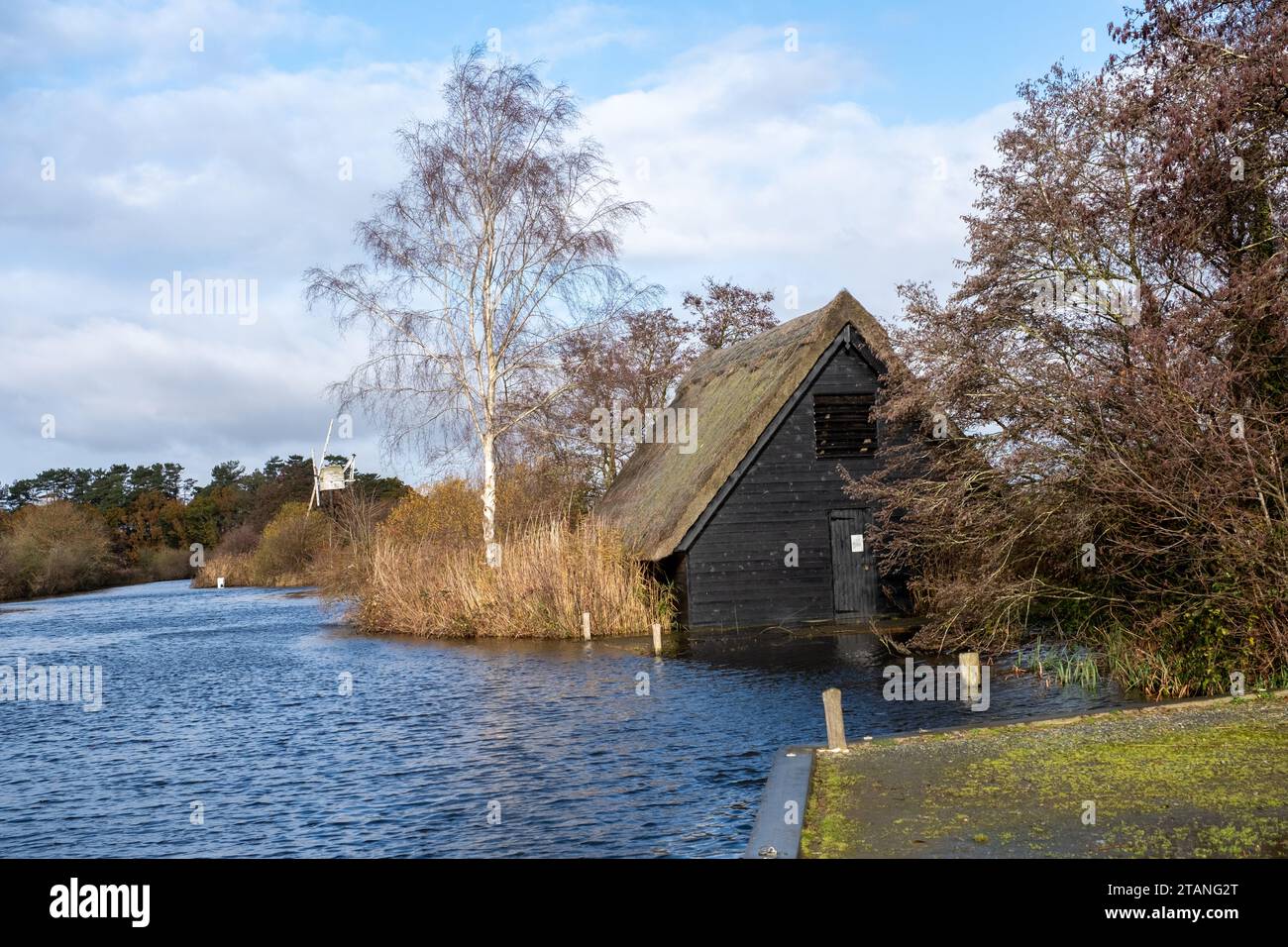 View down the river towards the wooden boat shed and drainage mill ...