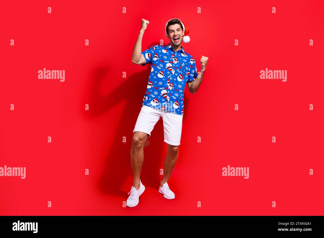 Full body photo of handsome young guy raise fists celebrate winning ...