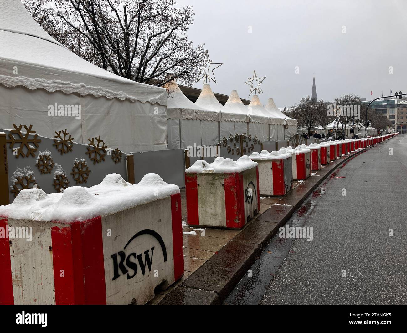 02 December 2023, Hamburg: Red and white concrete blocks are set up ...