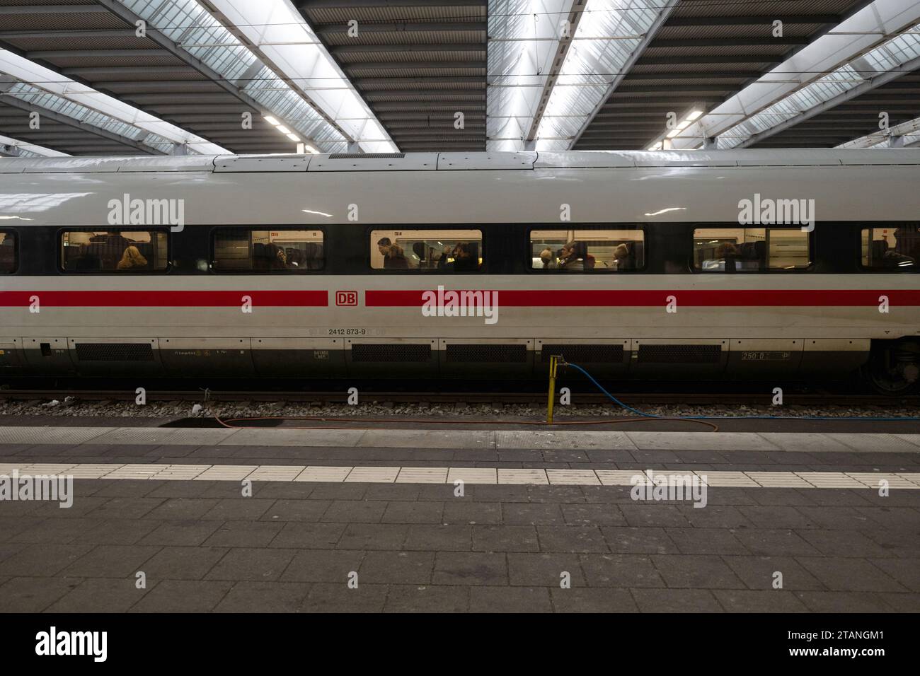 02 December 2023, Bavaria, Munich: Passengers wait in a parked train at ...
