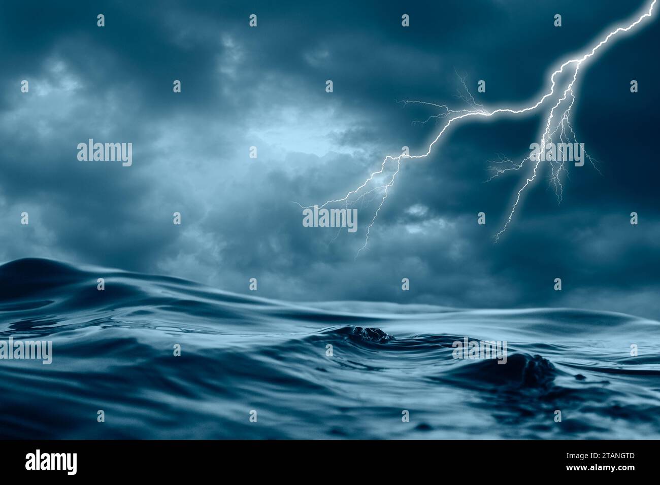 ocean waves with dark stormy sky and lightning Stock Photo - Alamy