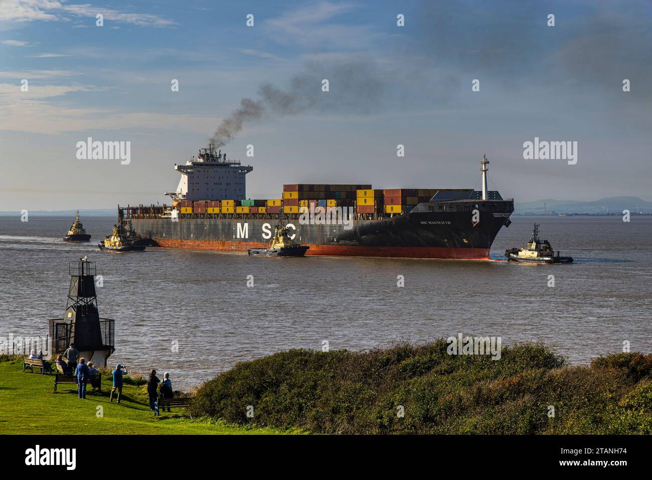 Container vessel MSC Magnum VII surrounded by tugs and heading for ...